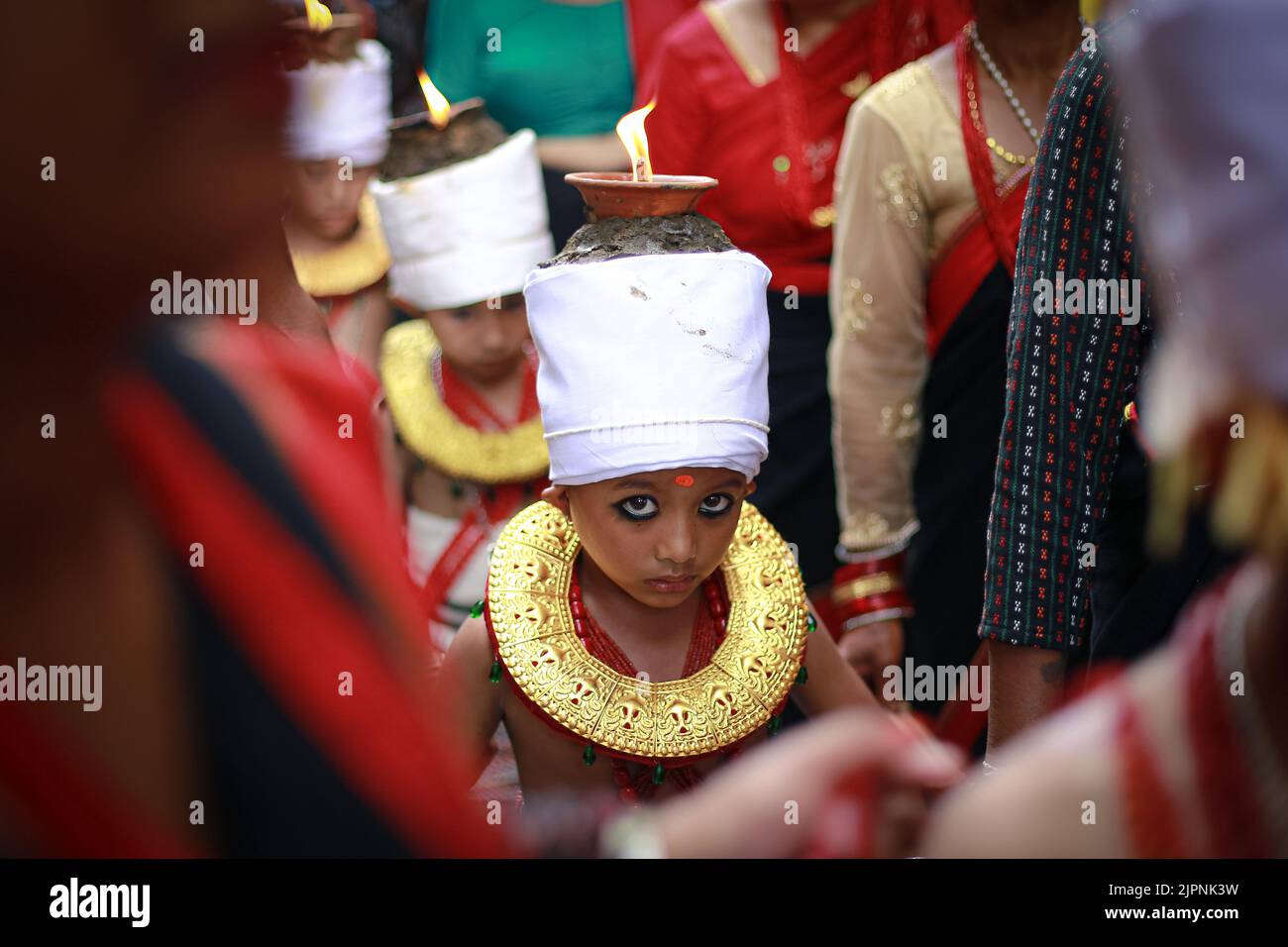 Bhaktapur, Bagmati, Nepal. 19th Aug, 2022. Devotees with lit oil lamps ...