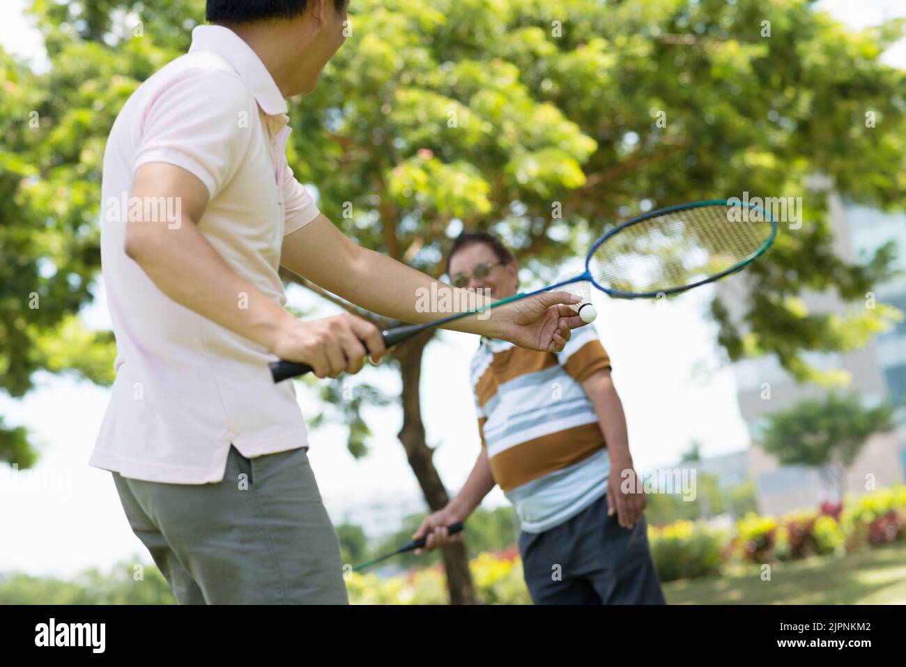 Adult man playing badminton with his father Stock Photo - Alamy