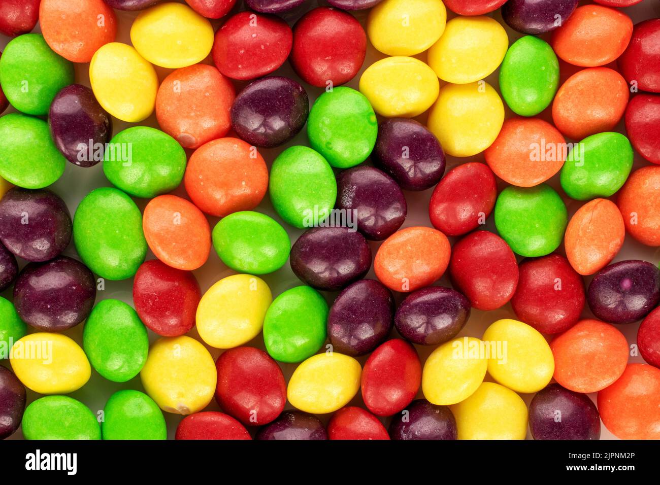 A lot of sweet colored candies, close-up, top view Stock Photo - Alamy