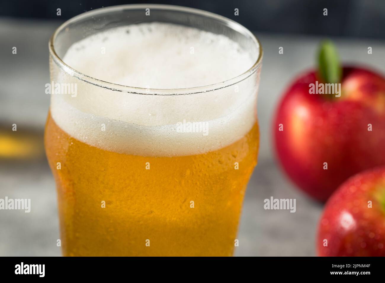 Boozy Refresing Cold Hard Apple Cider in a Pint Glass Stock Photo - Alamy