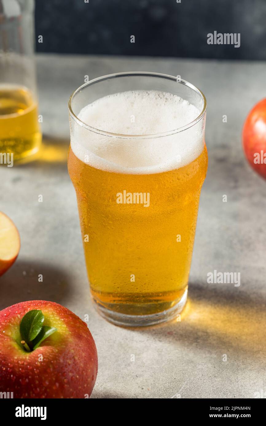 Boozy Refresing Cold Hard Apple Cider in a Pint Glass Stock Photo - Alamy