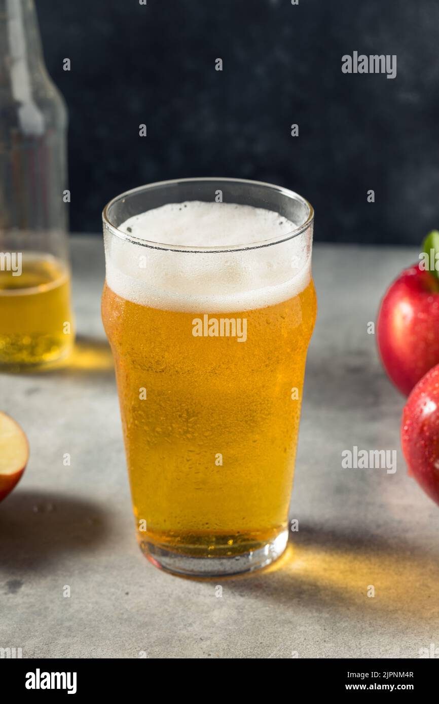 Boozy Refresing Cold Hard Apple Cider in a Pint Glass Stock Photo - Alamy