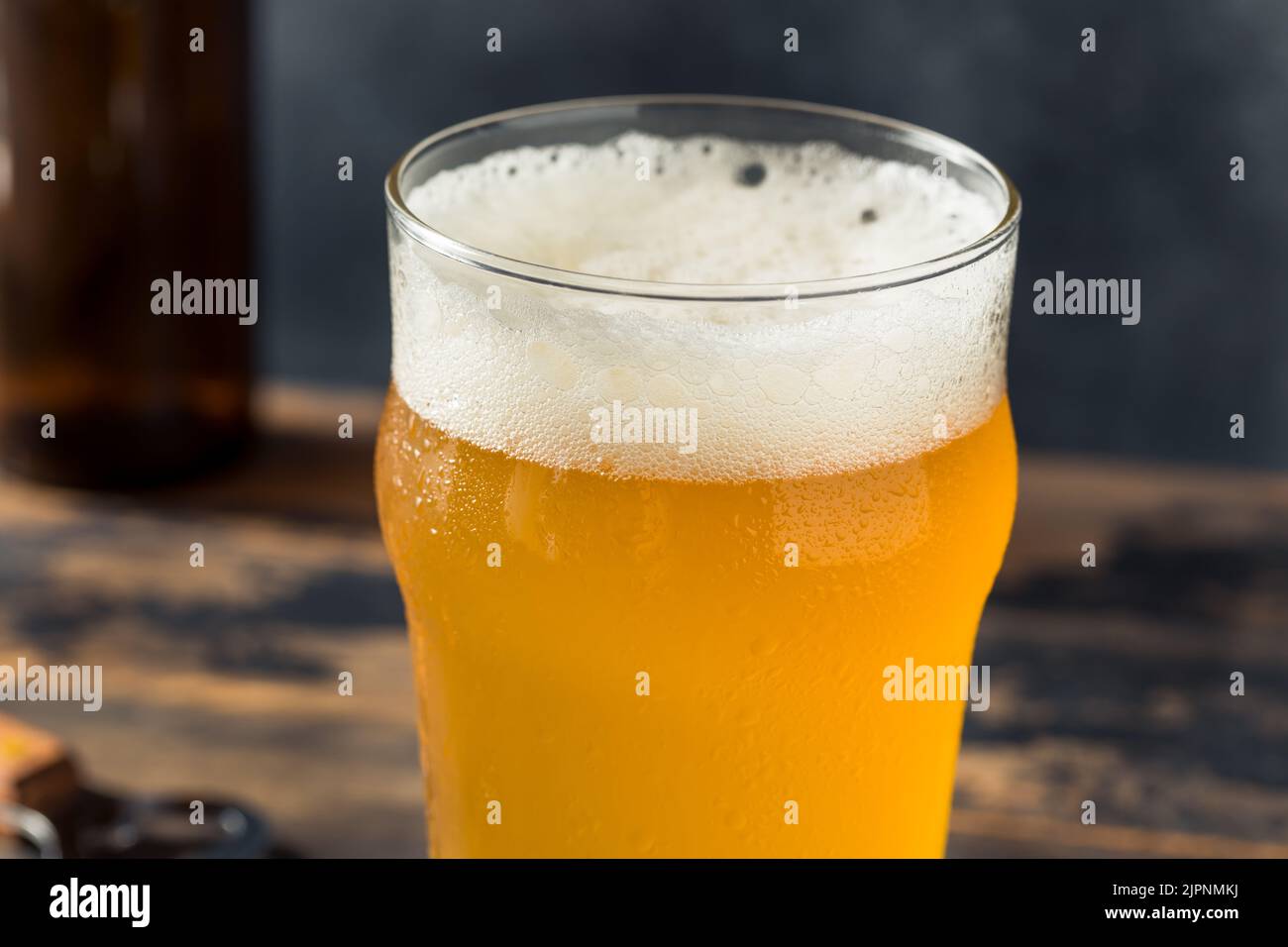 Cold Refreshing Boozy Farmhouse Ale Beer in a Pint Glass Stock Photo ...
