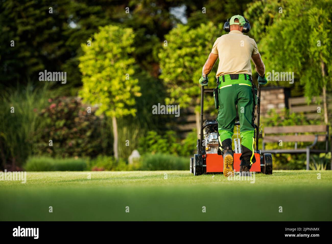 Professional Caucasian Landscaper Pushing Scarifier Machine. Removing ...