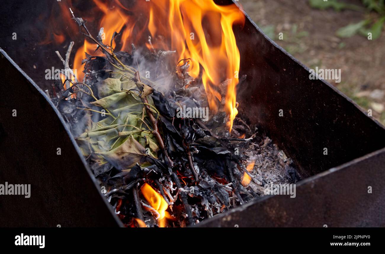 Burning red hot sparks fly from fire. Barbecue gril with glowing and ...