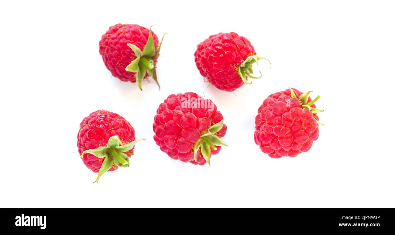 Group of ripe red raspberries with leaves isolated on white background ...