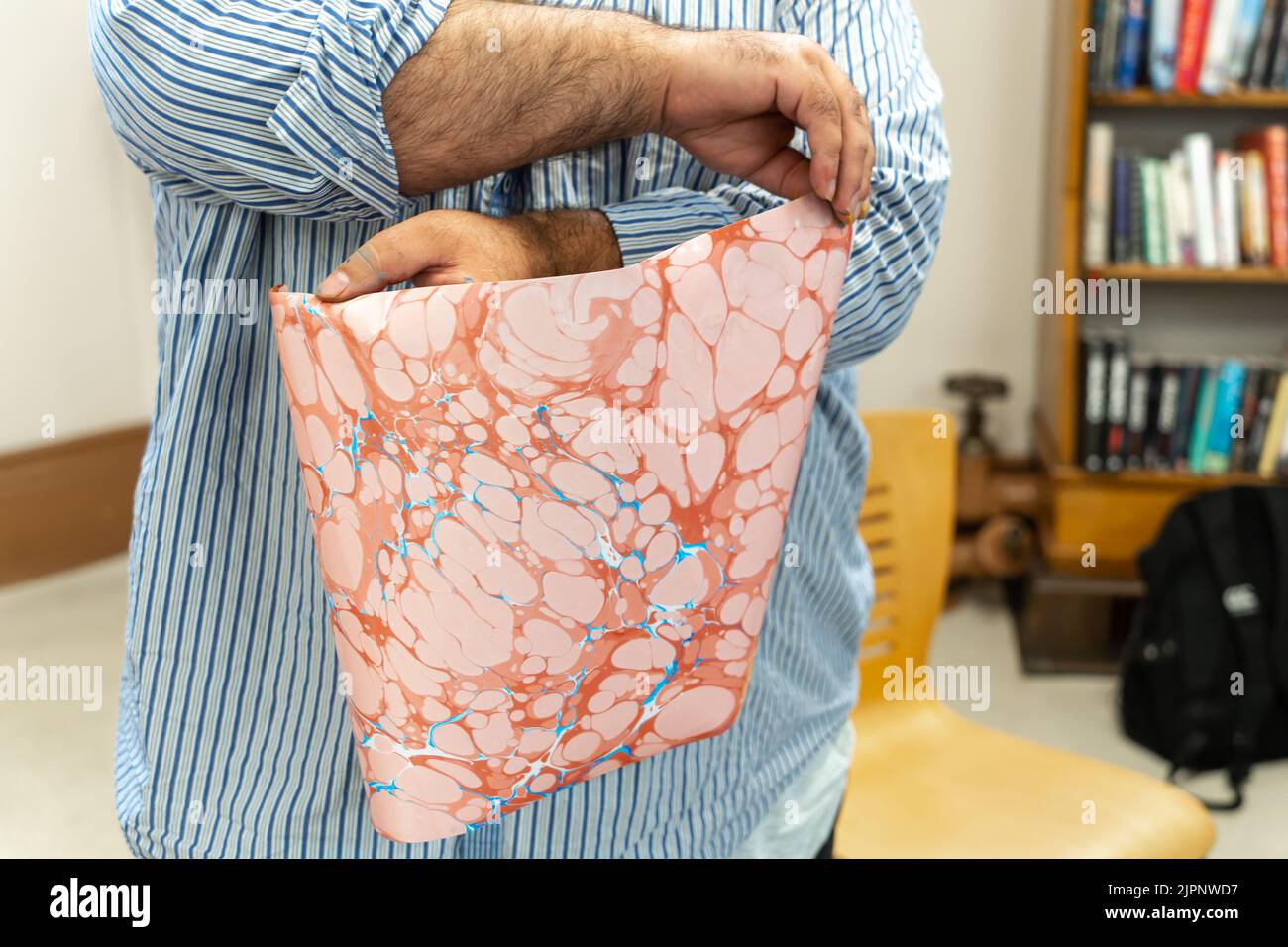 Artist Tugay Yalcin teaches beginners the art of paper marbling, a ...