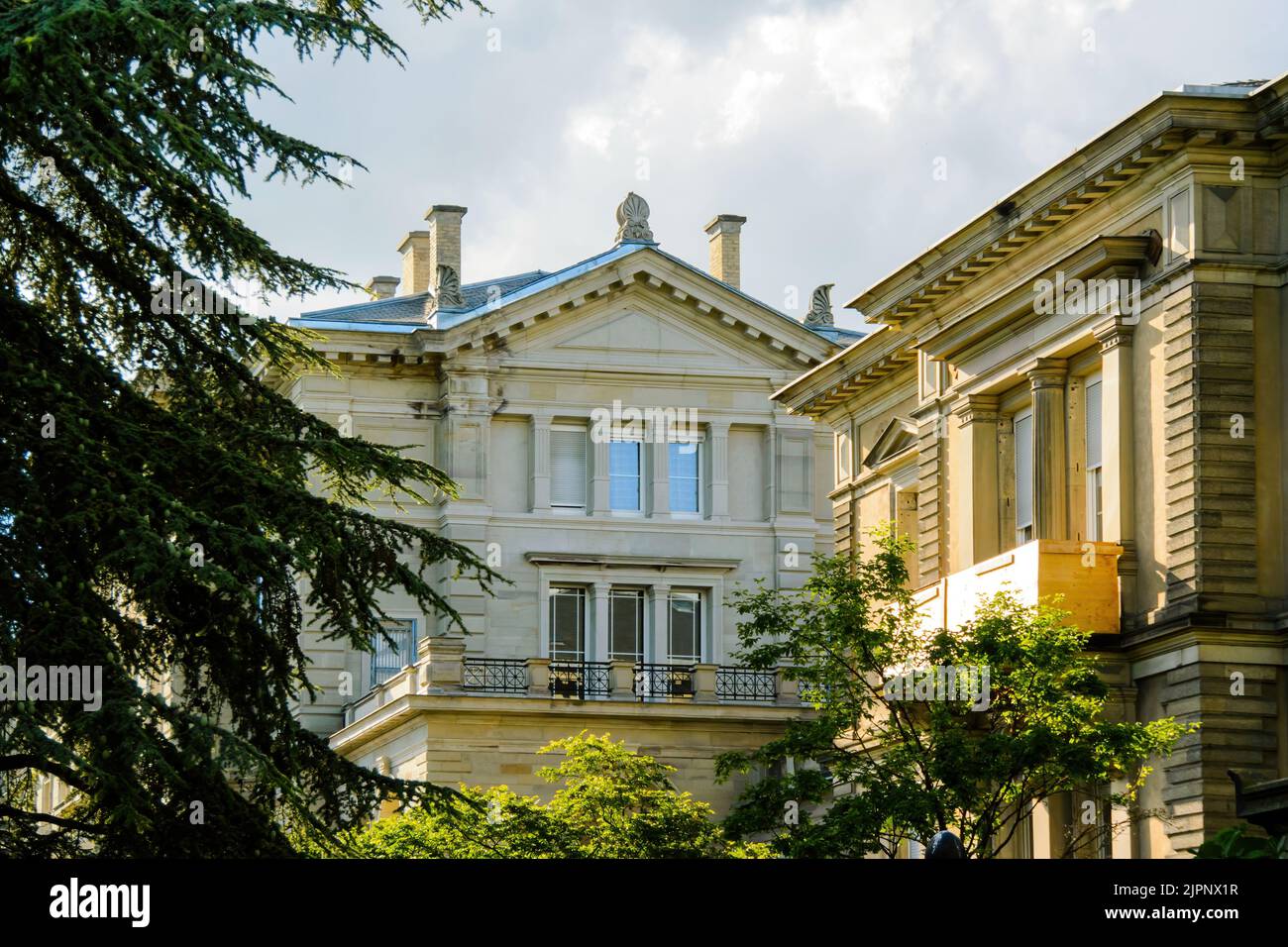 Luxury real estate in calm city - tall mansion castle made from white ...