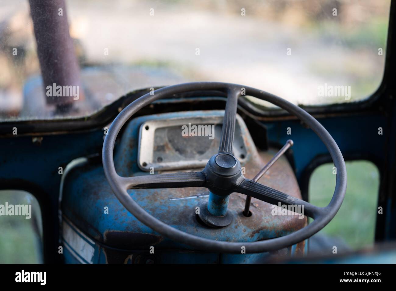 A tractor stirring wheel on the farm Stock Photo - Alamy