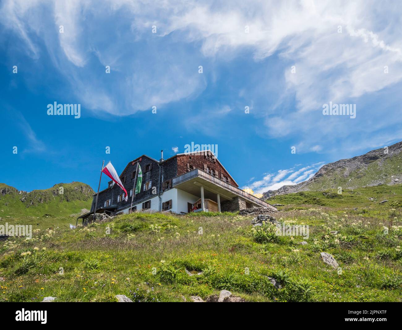 The image is of the Karl von Edel Hut mountain refuge above the resort ...