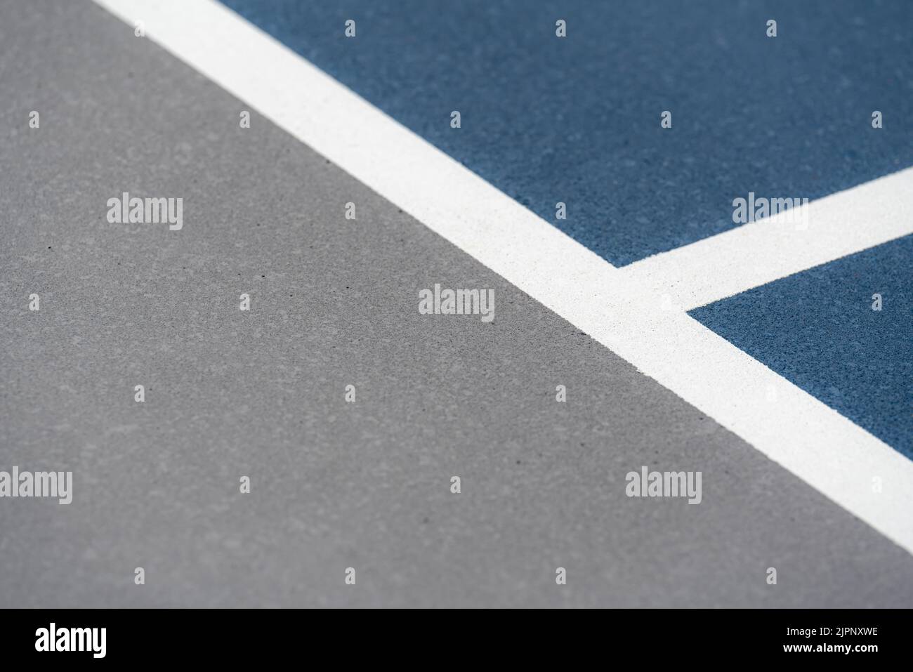 New blue tennis court with white lines and gray out of bounds Stock ...