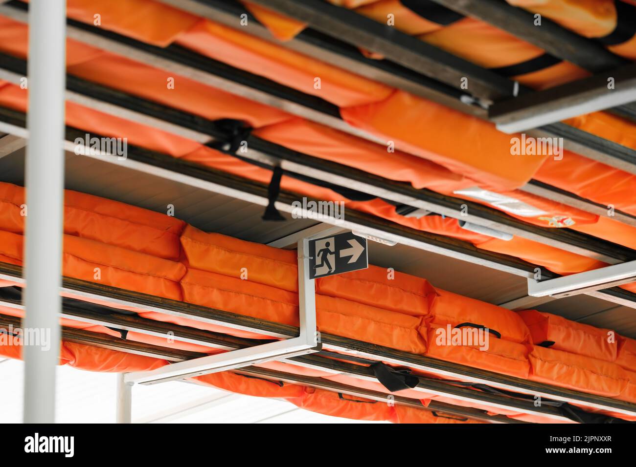 Orange life jackets for extremal situations on water attached to boat ...