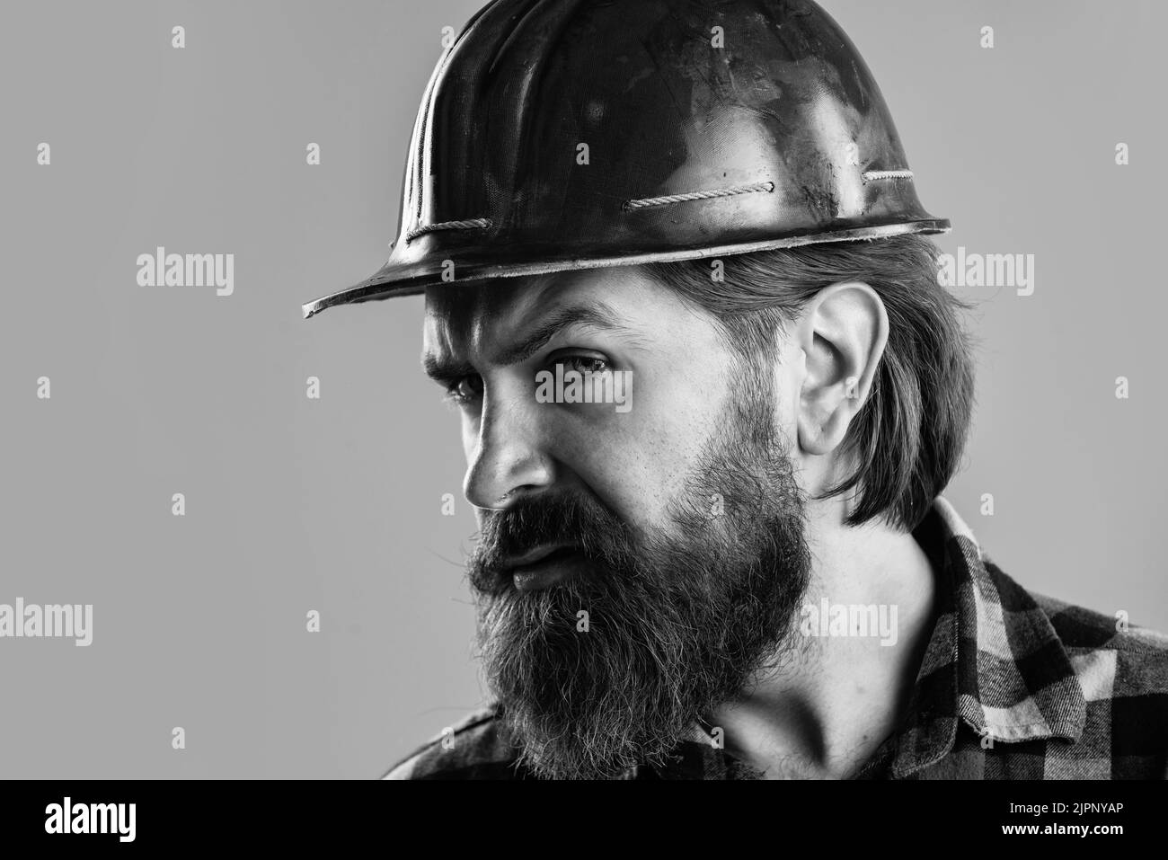 handsome bearded guy with beard and moustache wear helmet, protection ...