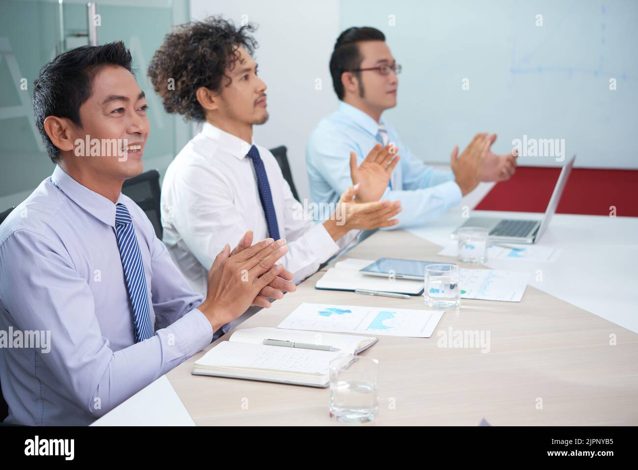 Group of Vietnamese business executive clapping to speaker Stock Photo ...