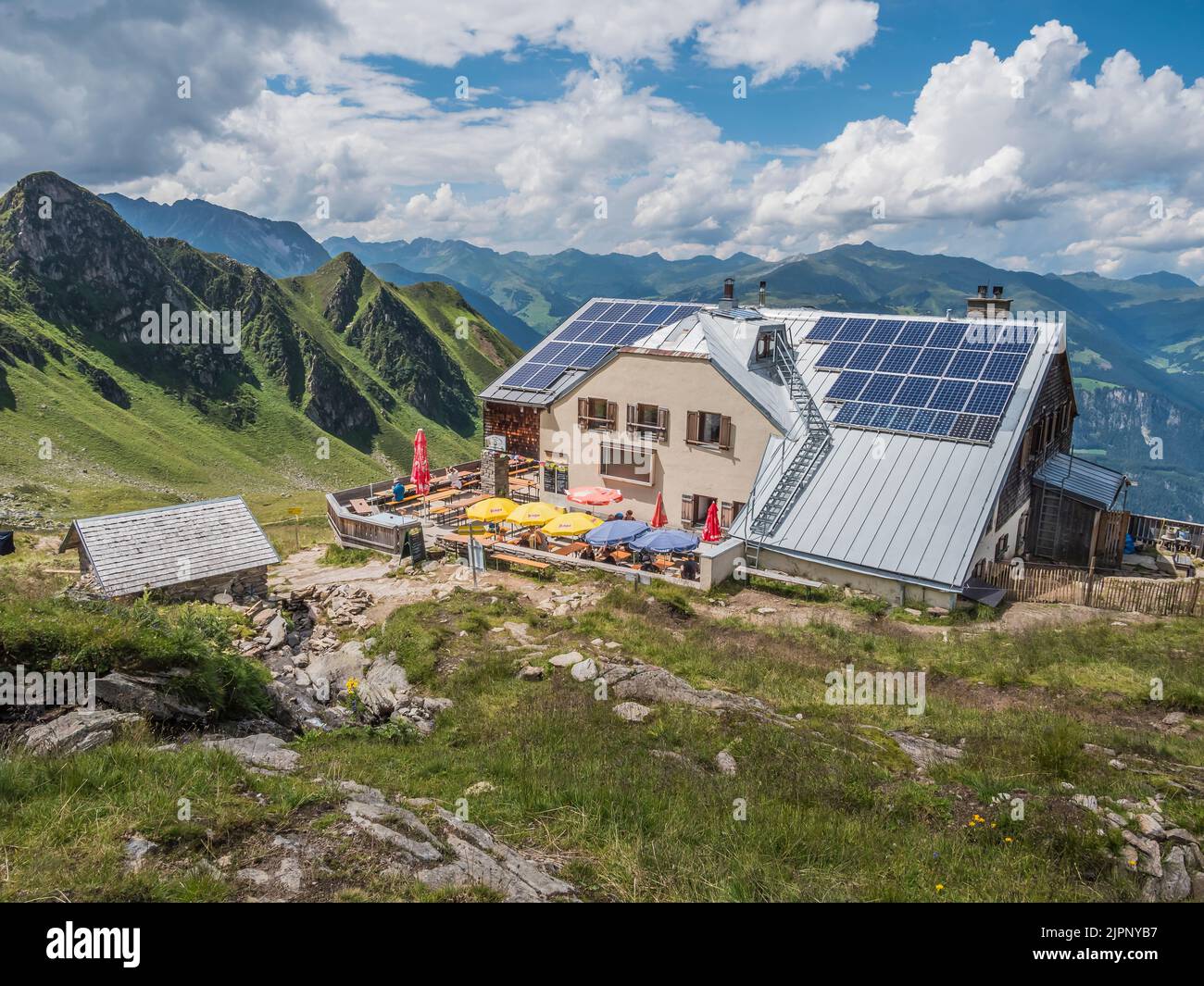 The image is of the Karl von Edel Hut mountain refuge above the resort ...