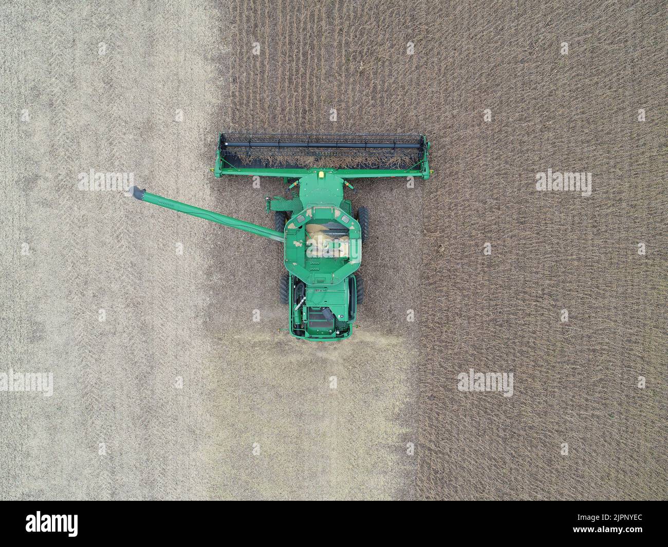 An aerial view of a large grain cart harvesting corn Stock Photo - Alamy