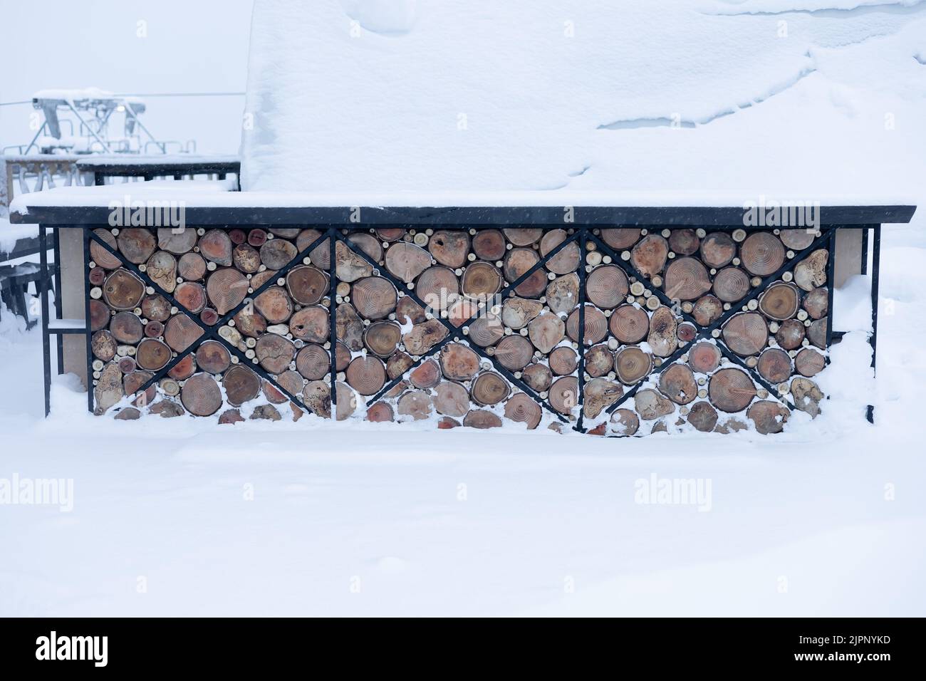 Bar counter in a snowy ski resort. Outdoor cafe in winter under snow ...
