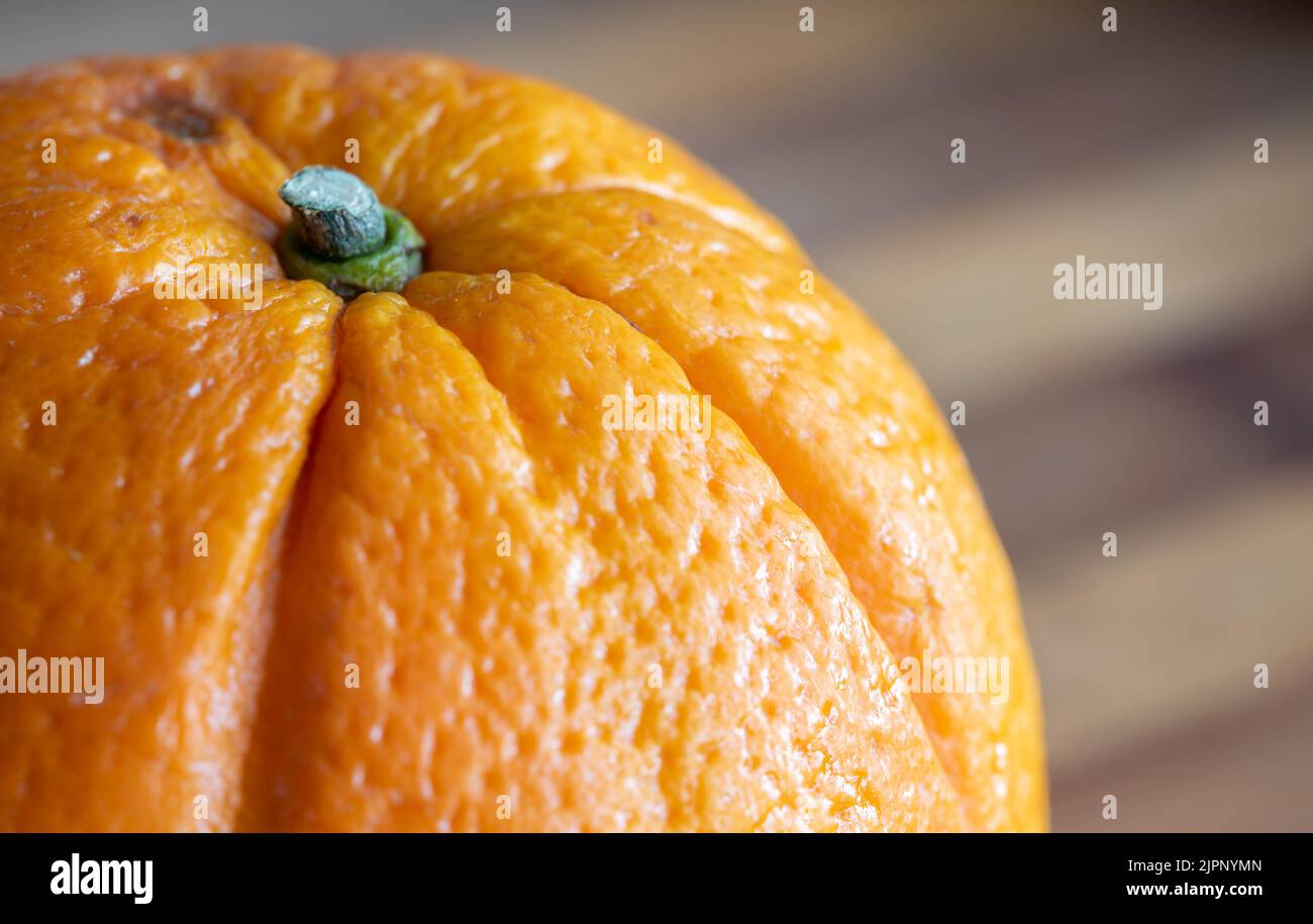 Orange in close-up. Structure of an orange peel on a macro scale. Juicy ...