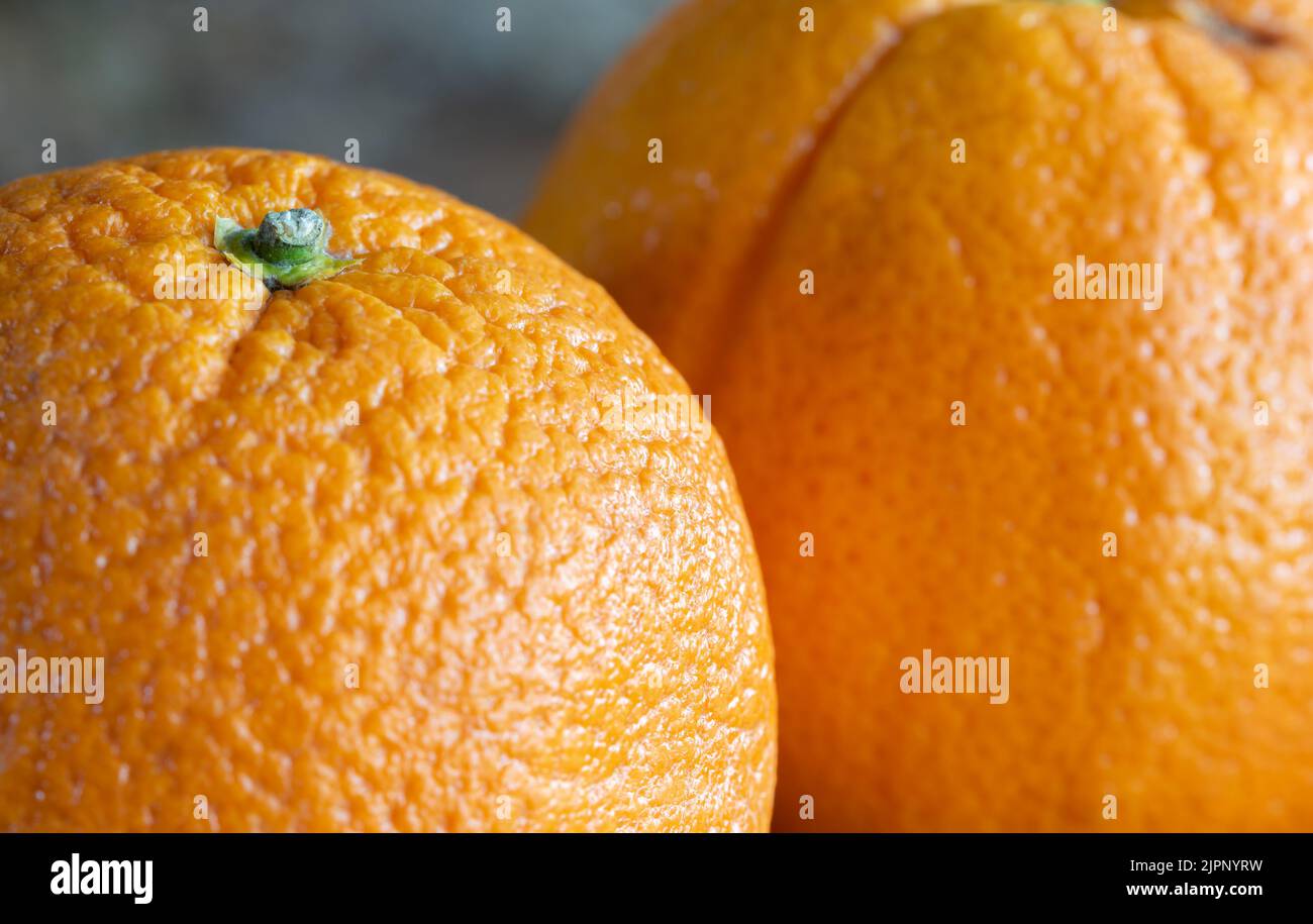 Orange in close-up. Structure of an orange peel on a macro scale. Juicy ...