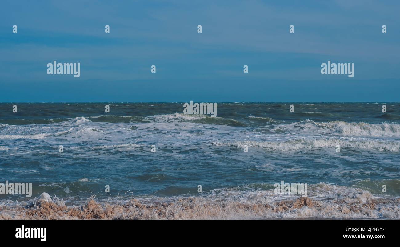 Ocean storm waves dramatically crashing splashing. Sky horizon line ...