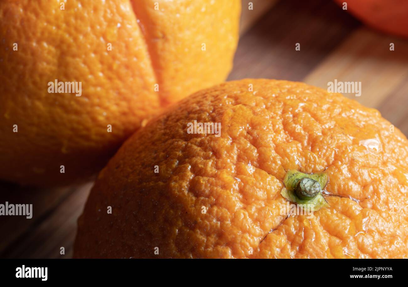 Orange in close-up. Structure of an orange peel on a macro scale. Juicy ...
