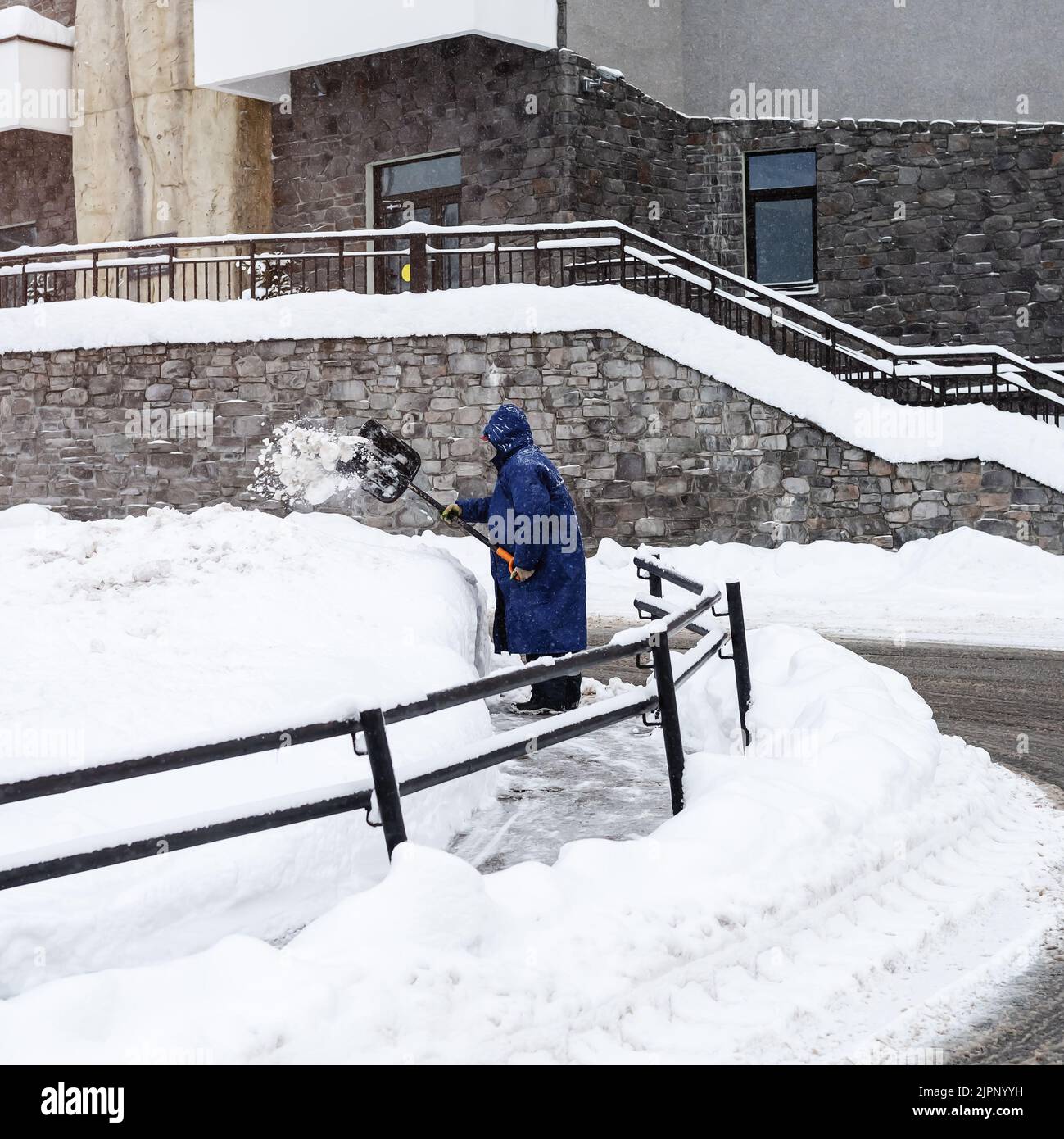 Spade shovel snow bad weather uniform hi-res stock photography and ...