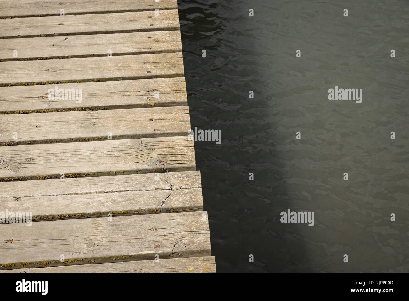 close up of footbridge wooden planks over the water Stock Photo - Alamy