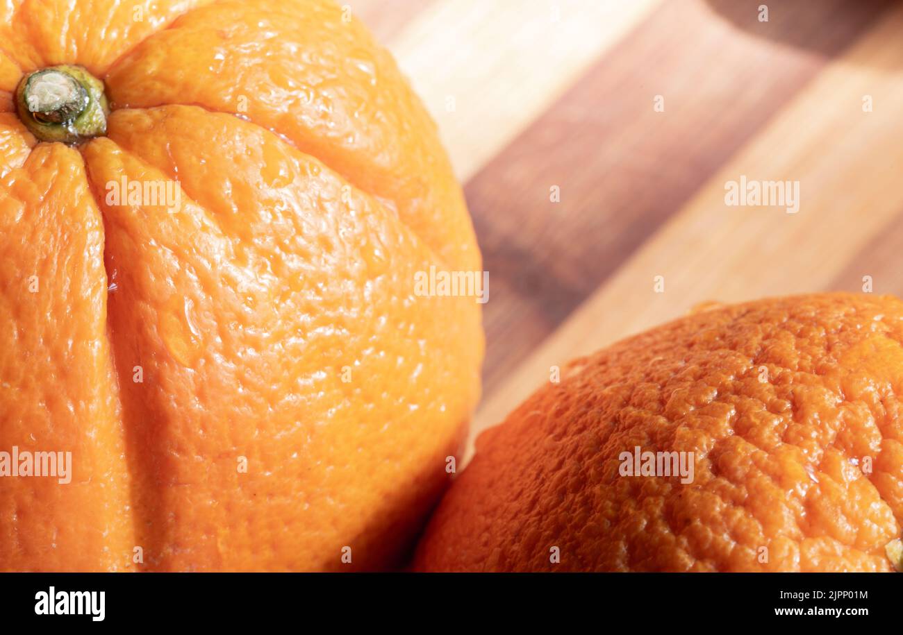 Orange in close-up. Structure of an orange peel on a macro scale. Juicy ...