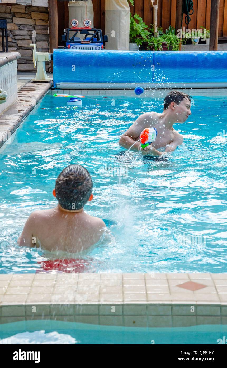 Blue water pistol hi-res stock photography and images - Alamy