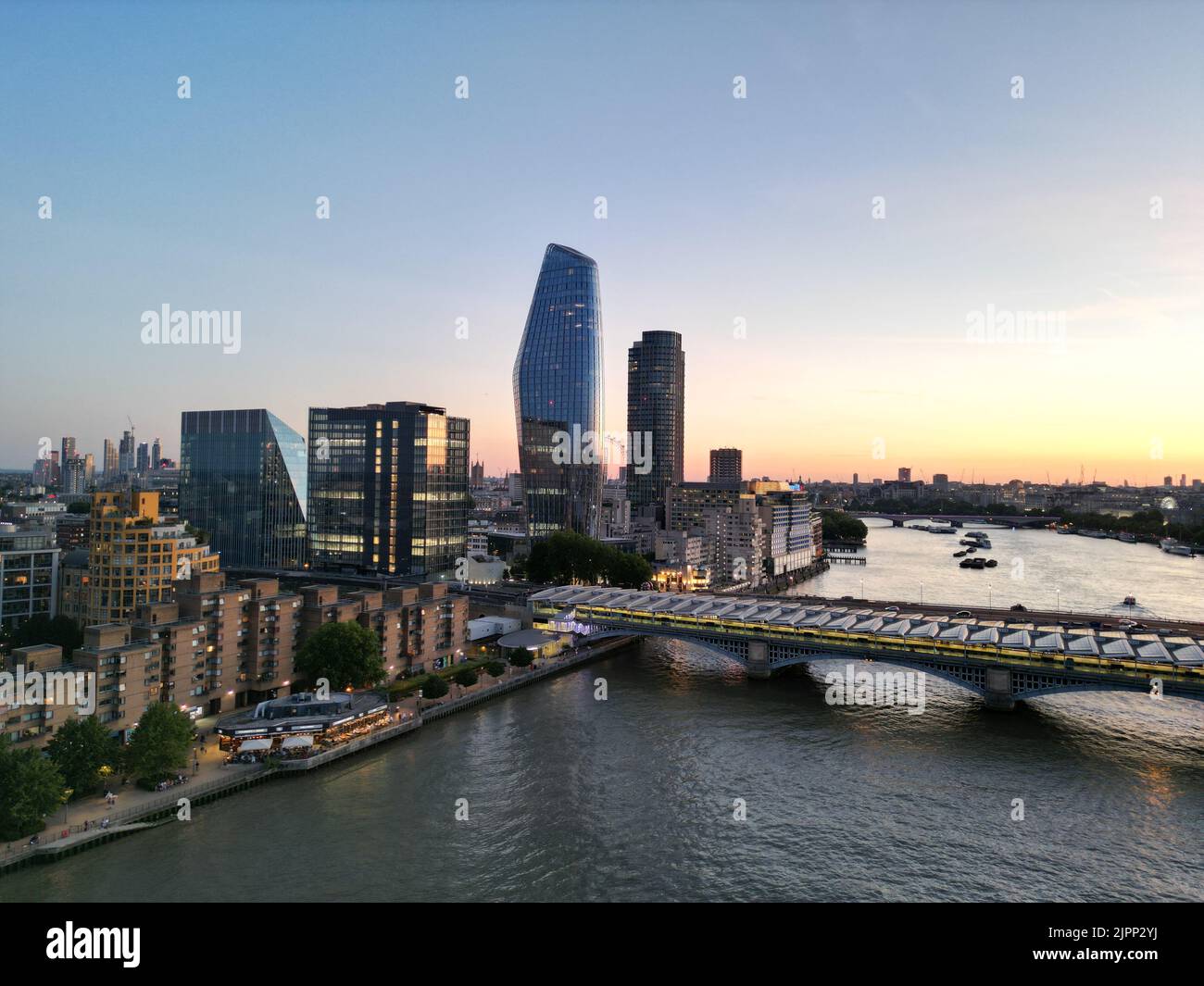 Skyline with office buildings tower of london at sunset hi-res stock ...