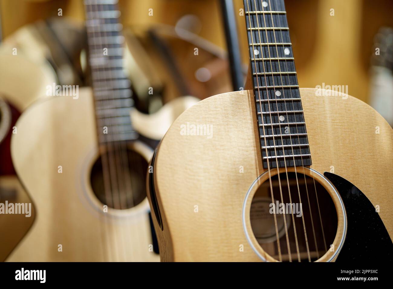 Photo of acoustic guitars in a store Stock Photo - Alamy