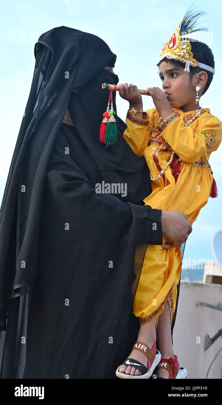 Ajmer, Rajasthan, India. 18th Aug, 2022. A muslim woman holds a child ...