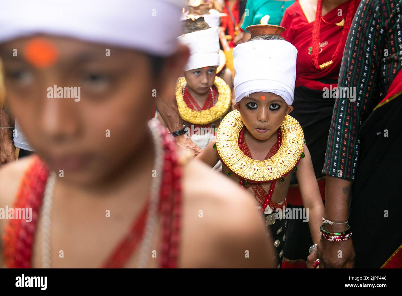 Bhaktapur, Nepal. 19th Aug, 2022. Devotees with lit oil lamps perform ...