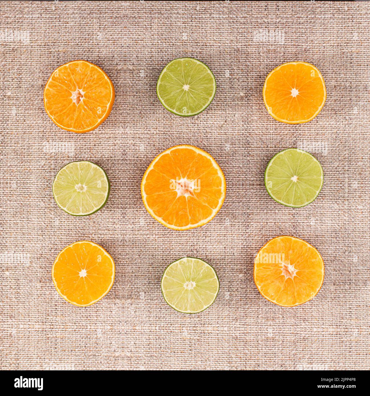 Summer layout with sliced citrus fruits on beige background. Flat lay ...