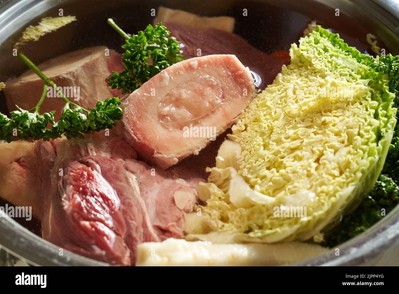 Ingredients for beef broth or soup - marrow bones, meat and fresh ...