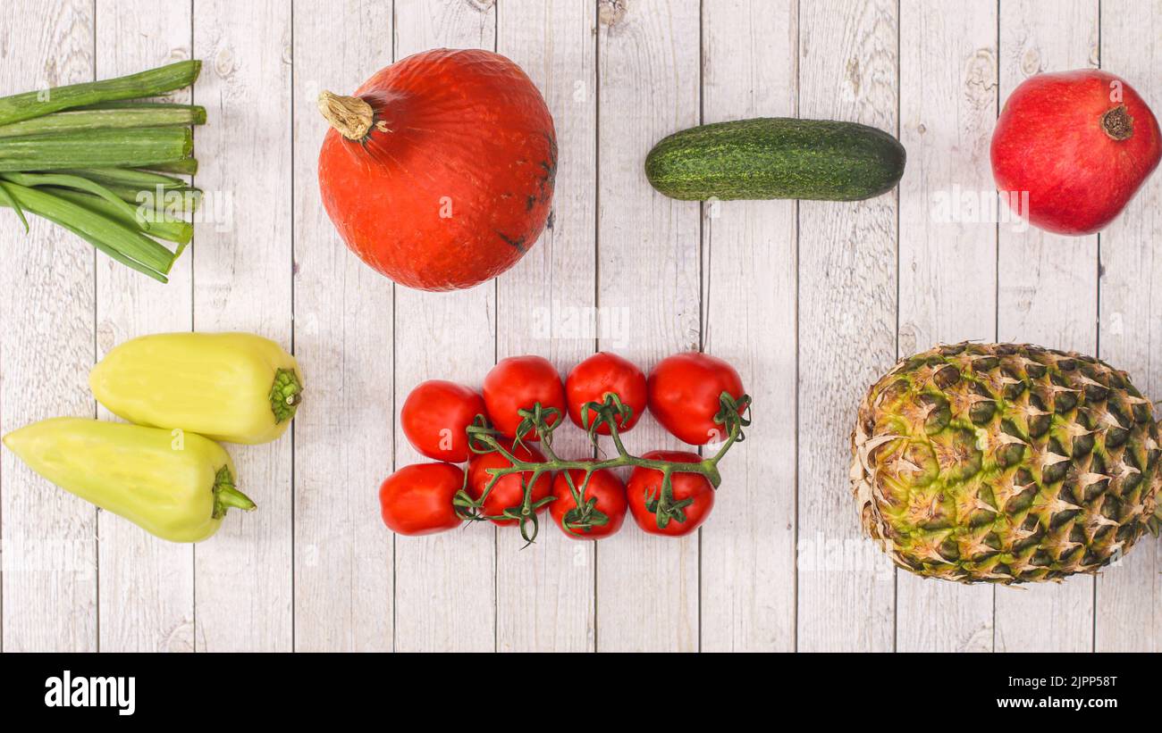 Wooden table with fresh vegetables and fruits composition. Flat lay ...
