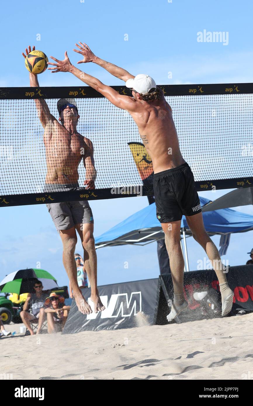 Avery Drost tries to hit around the block of Logan Webber at the AVP ...