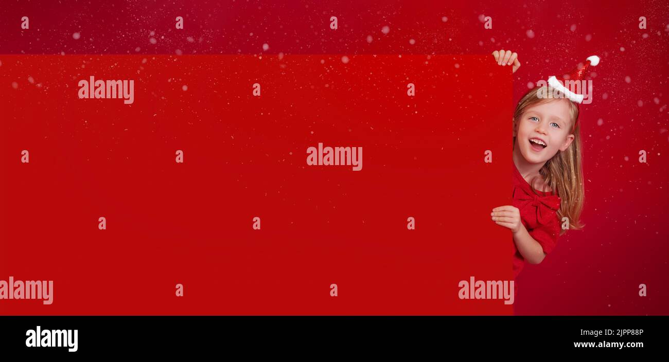 Merry Christmas poster copy paste. girl dressed as Santa Claus on a red ...