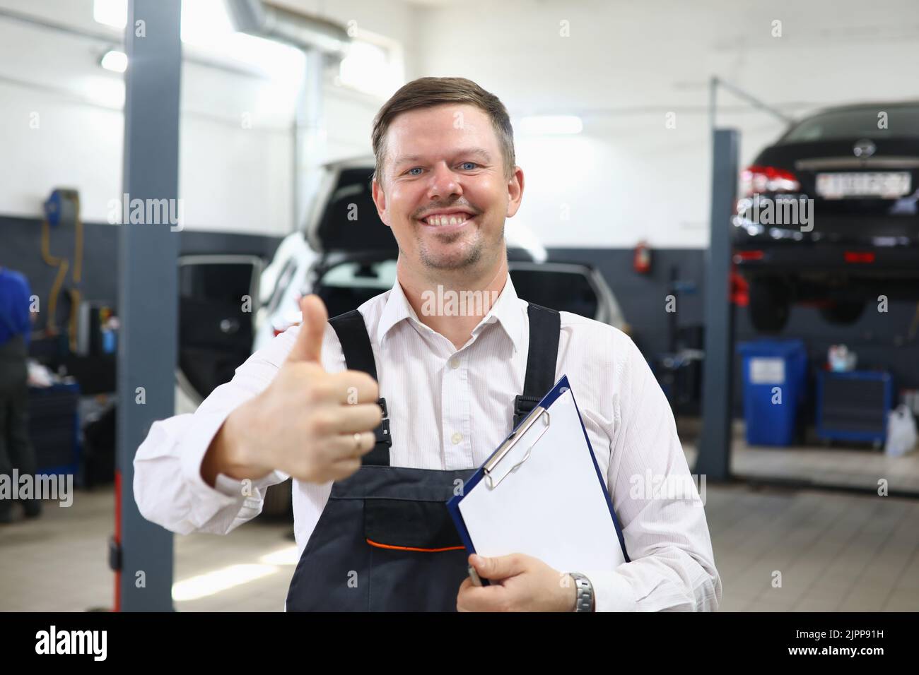 Mechanic showing thumbs up sign hi-res stock photography and images - Alamy
