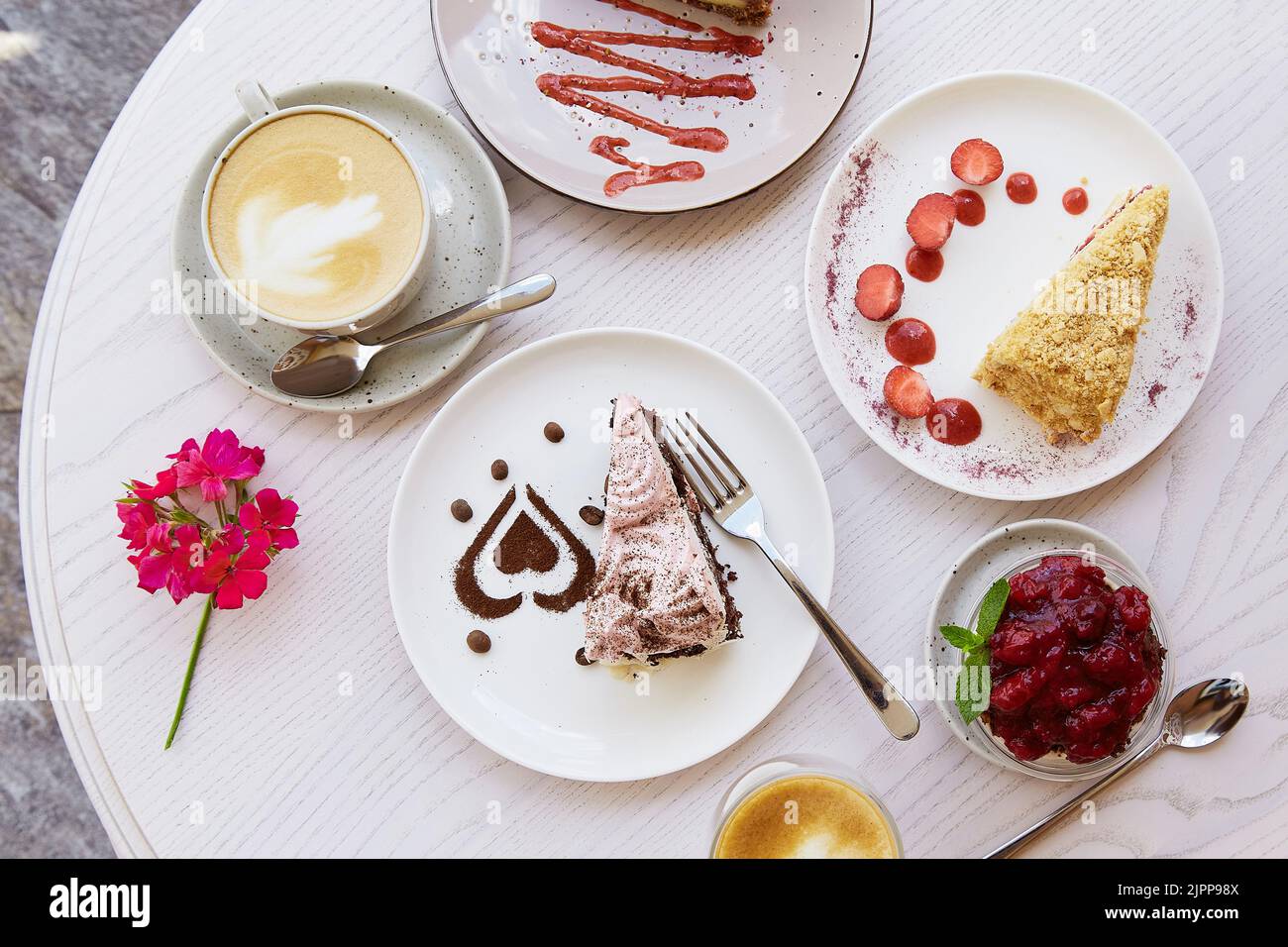 Assortment of natural vegan, layered desserts, piece of cakes with ...