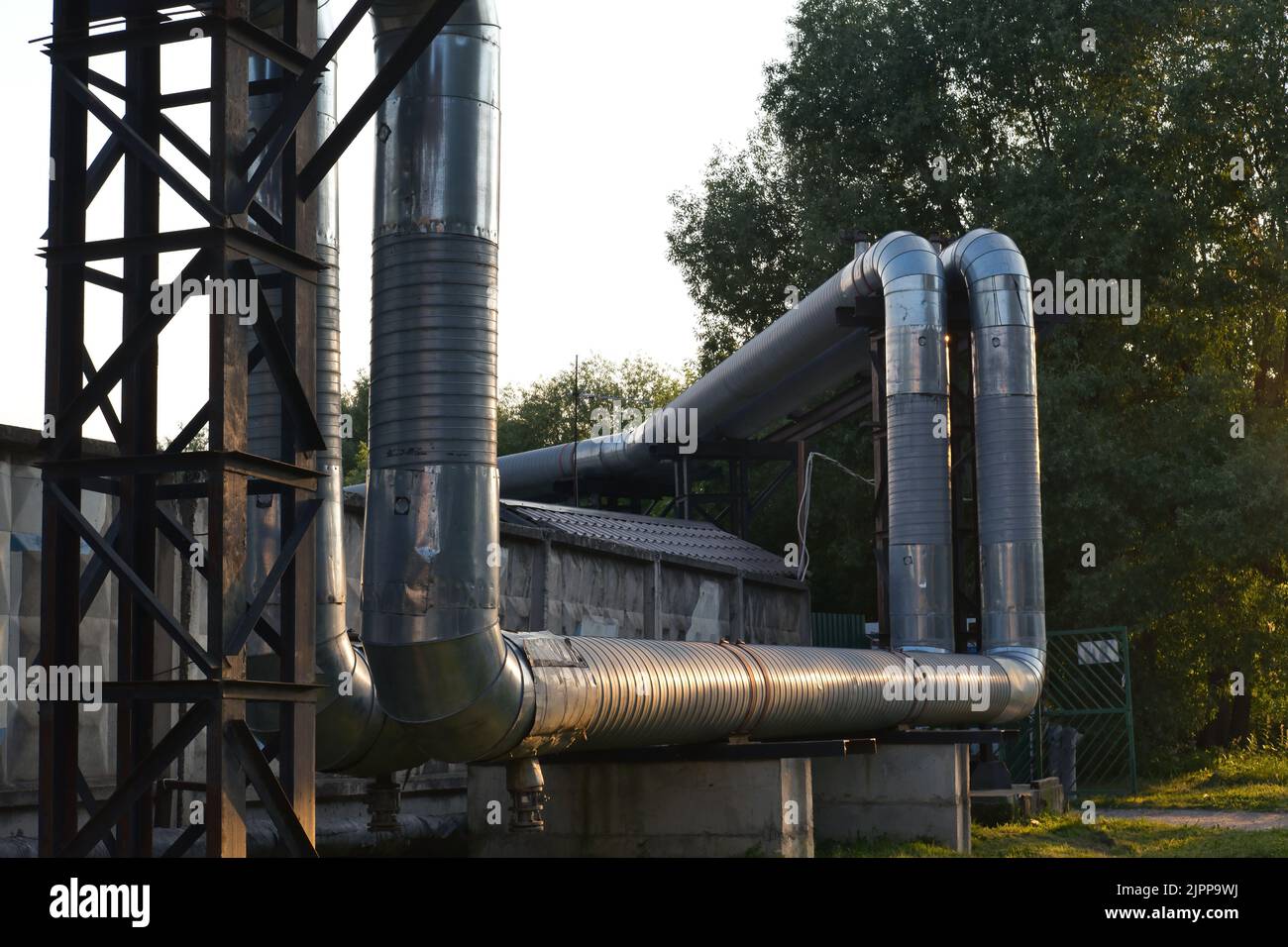 Outdoors pipelines of the heating system in the city. Two pipes in ...