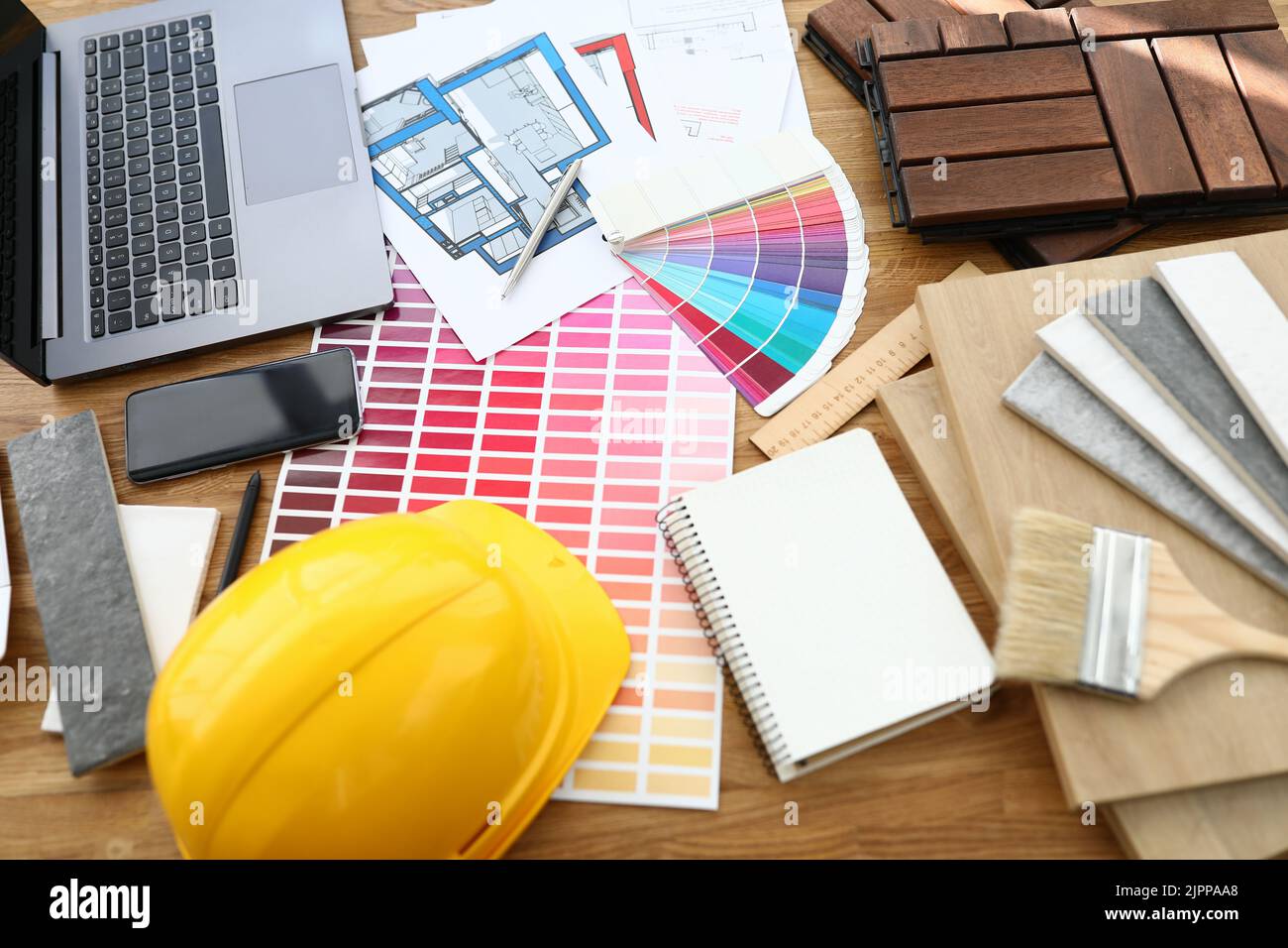 Overhead view of architect workplace drawing floor plan of modern house ...