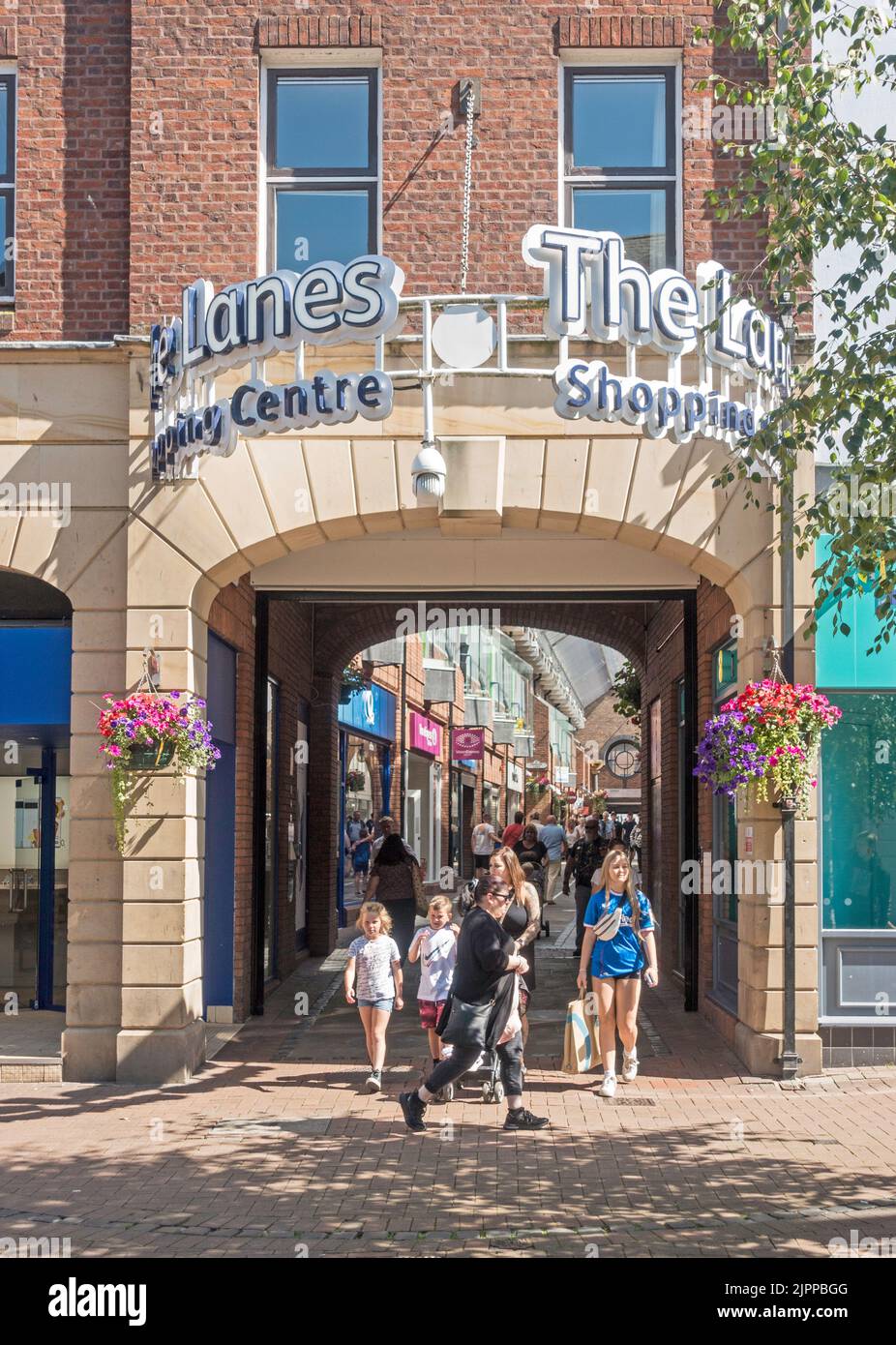 People at the entrance to The Lanes shopping centre in Carlisle ...