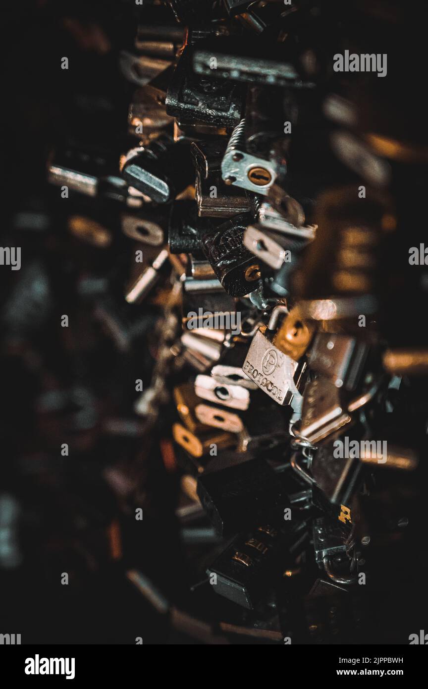 A random collection of rustic vintage padlocks hooked on a wall Stock ...
