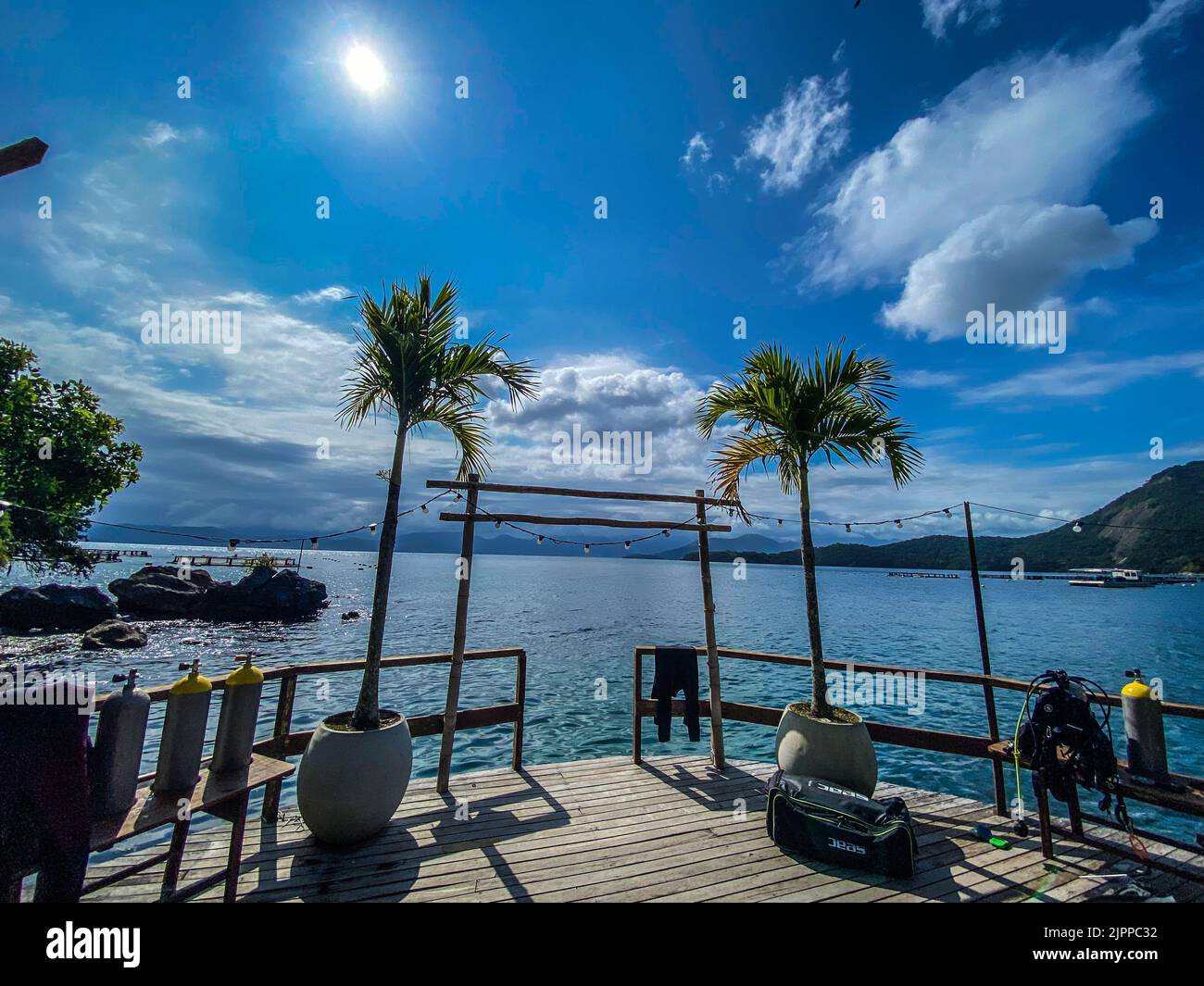 A beautiful view of the sea and tropical islands from a wooden platform ...