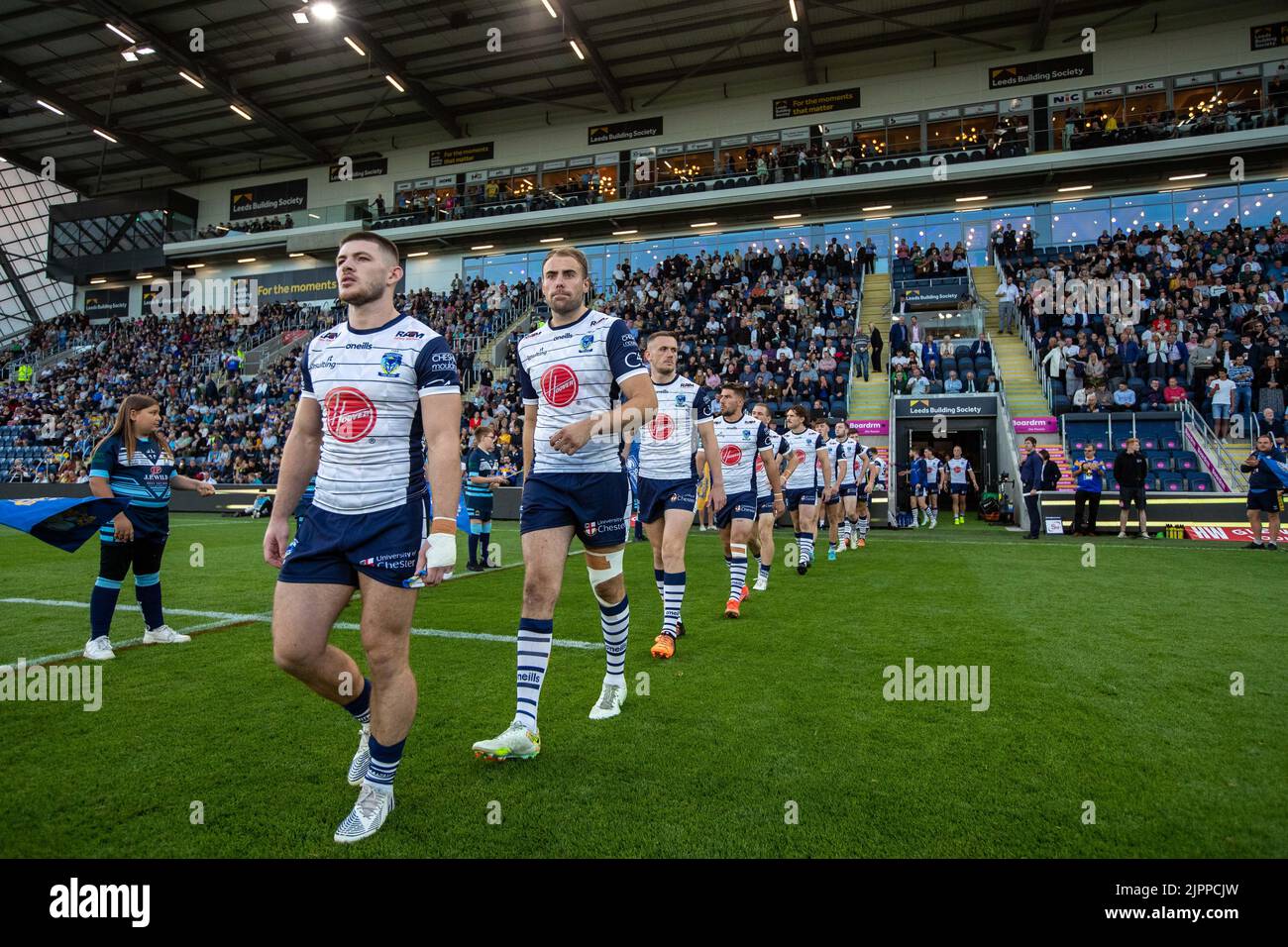 The Warrington Wolves team walk out of the tunnel ahead of kick off ...
