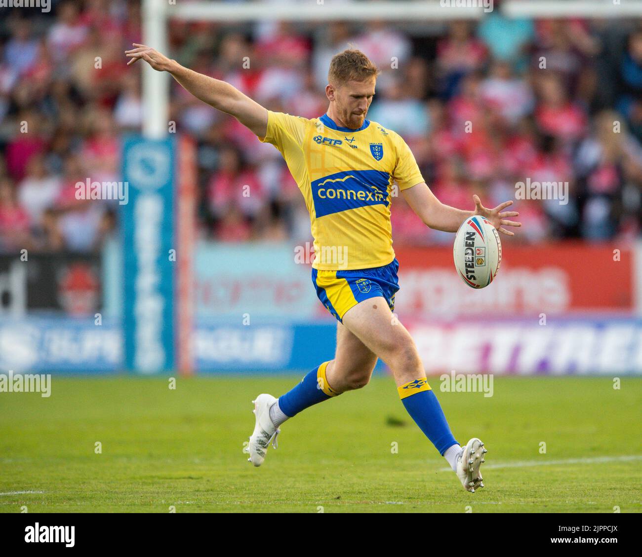 Rowan Milnes #21 of Hull KR kicks ahead Stock Photo - Alamy