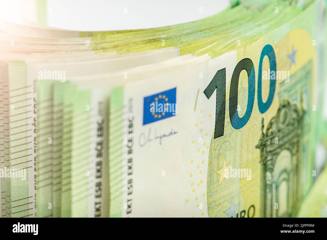 Close-up of a stack of paper bills, side view. Euro banknotes stacked ...