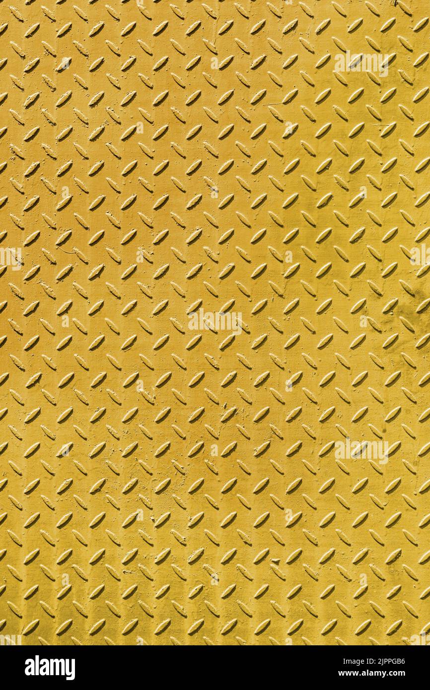 Yellow metal surface with diamond plate texture. The diamond steel ...