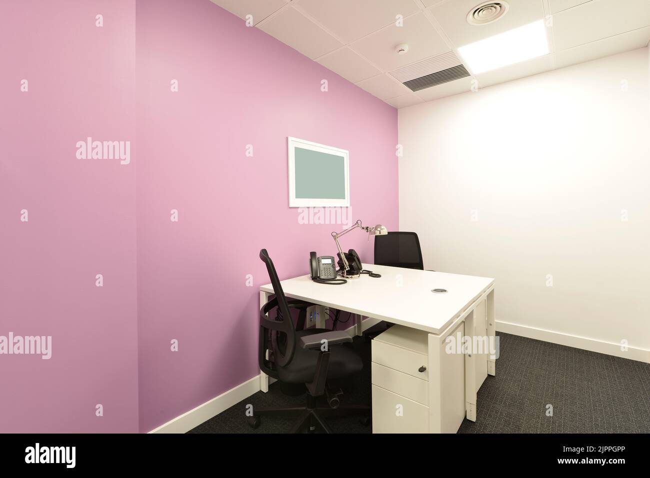 Small office cubicle with a double white desk, matching chest of ...